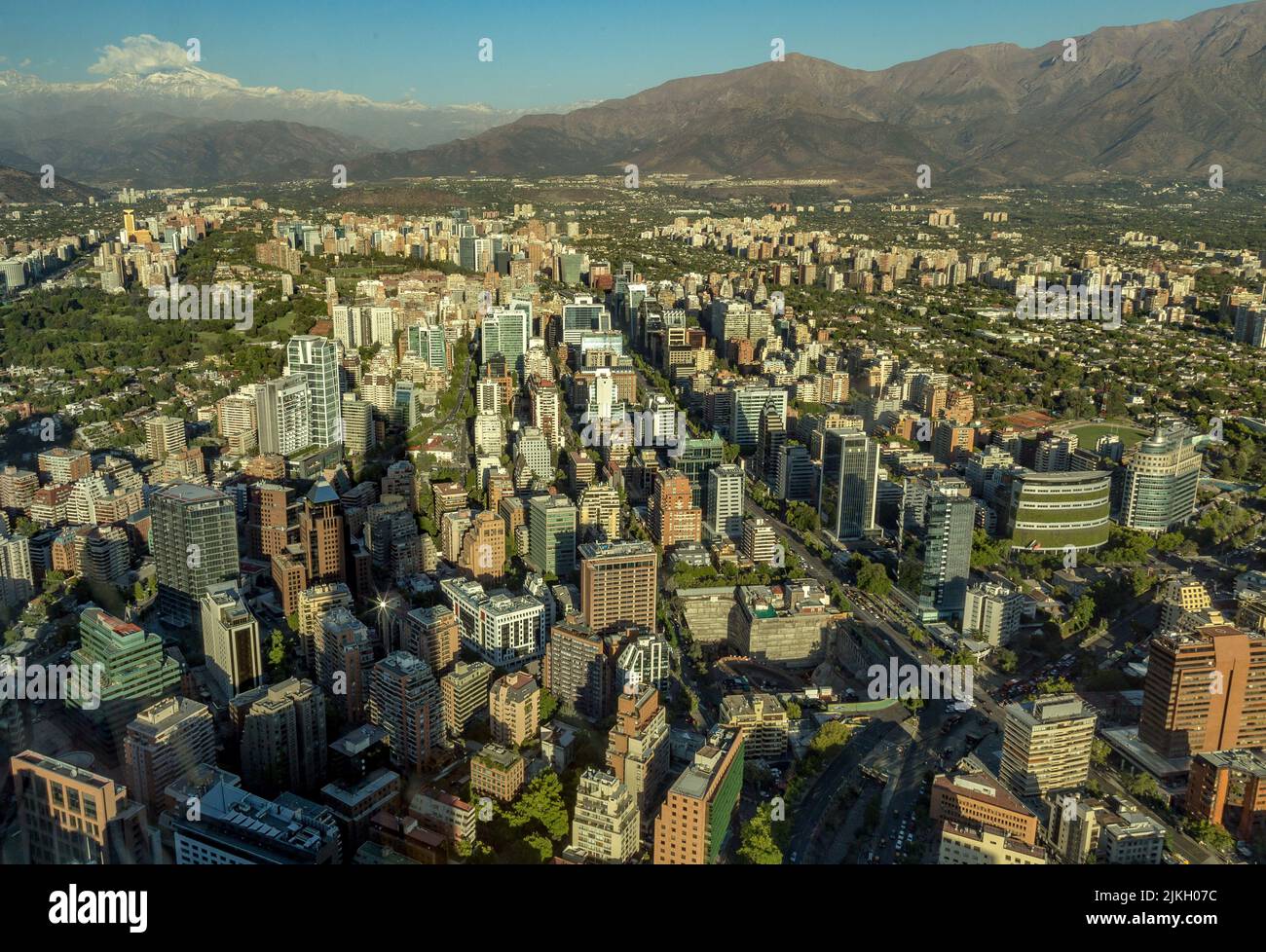 An aerial view of Santiago with the Andes Mountains in the background ...