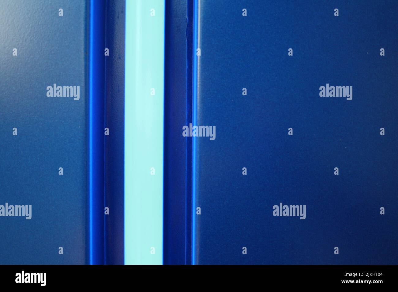 A texture of blue wall with light blue neon strip Stock Photo - Alamy