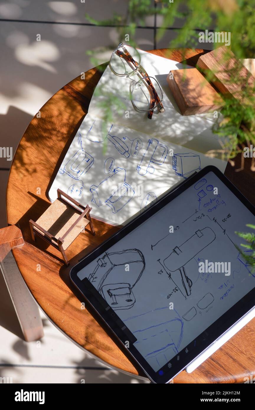 furniture design, digital drawing in tablet and analog in notebook ...