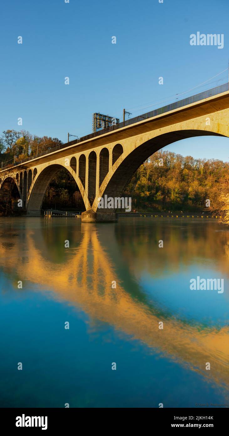 A vertical shot of a bridge over the Rhone River in Jonction, Geneva ...