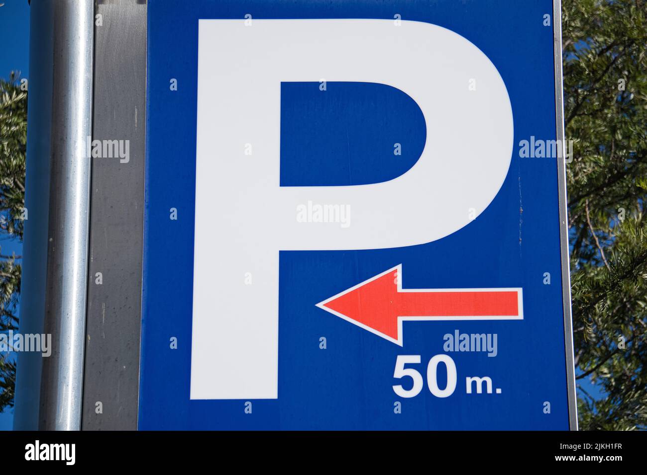 A blue parking sign indicating a parking lot 50 meters away Stock Photo ...
