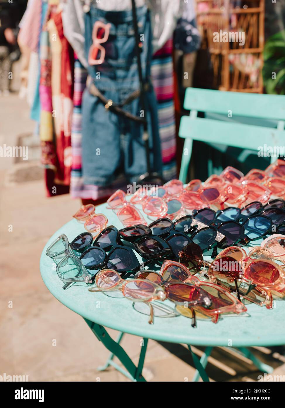 A vintage retro fashion shop sunglasses and clothes display in the ...