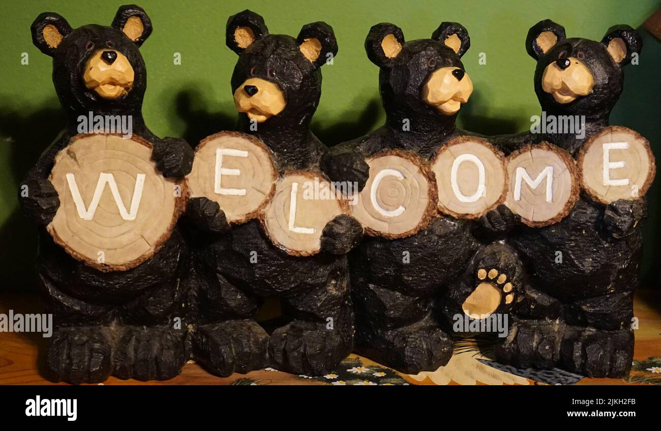 The sculpture of black bears with a welcome sign Stock Photo - Alamy