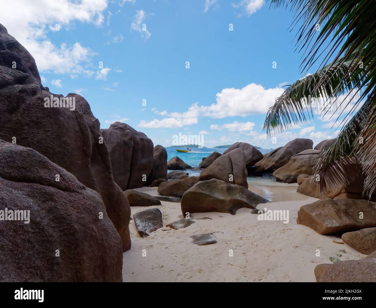 A breathtaking shot of beautiful La Digue Island beach with big rocks ...