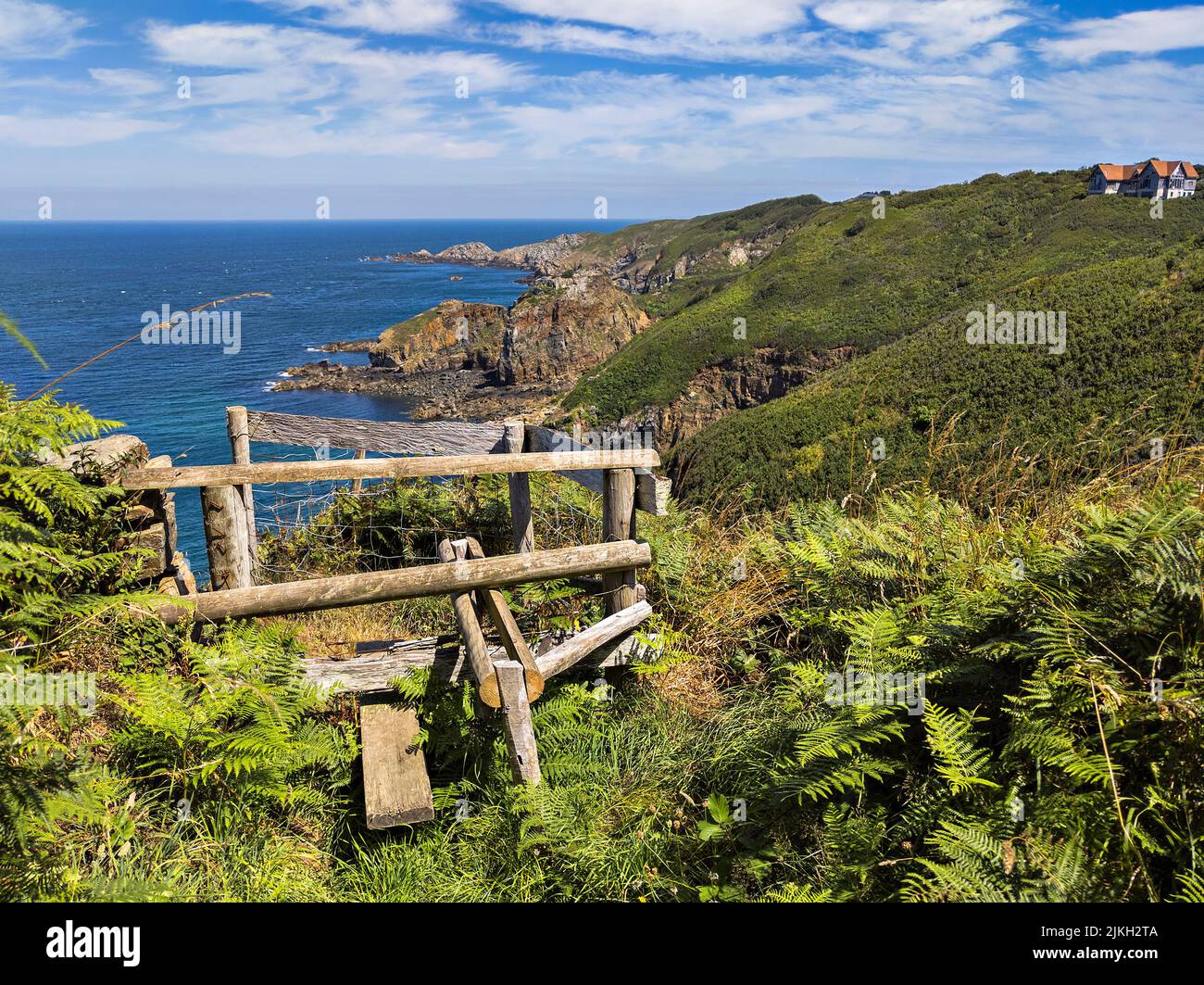 A countryside style step-over gate to a cliff path on Sark's west coast ...
