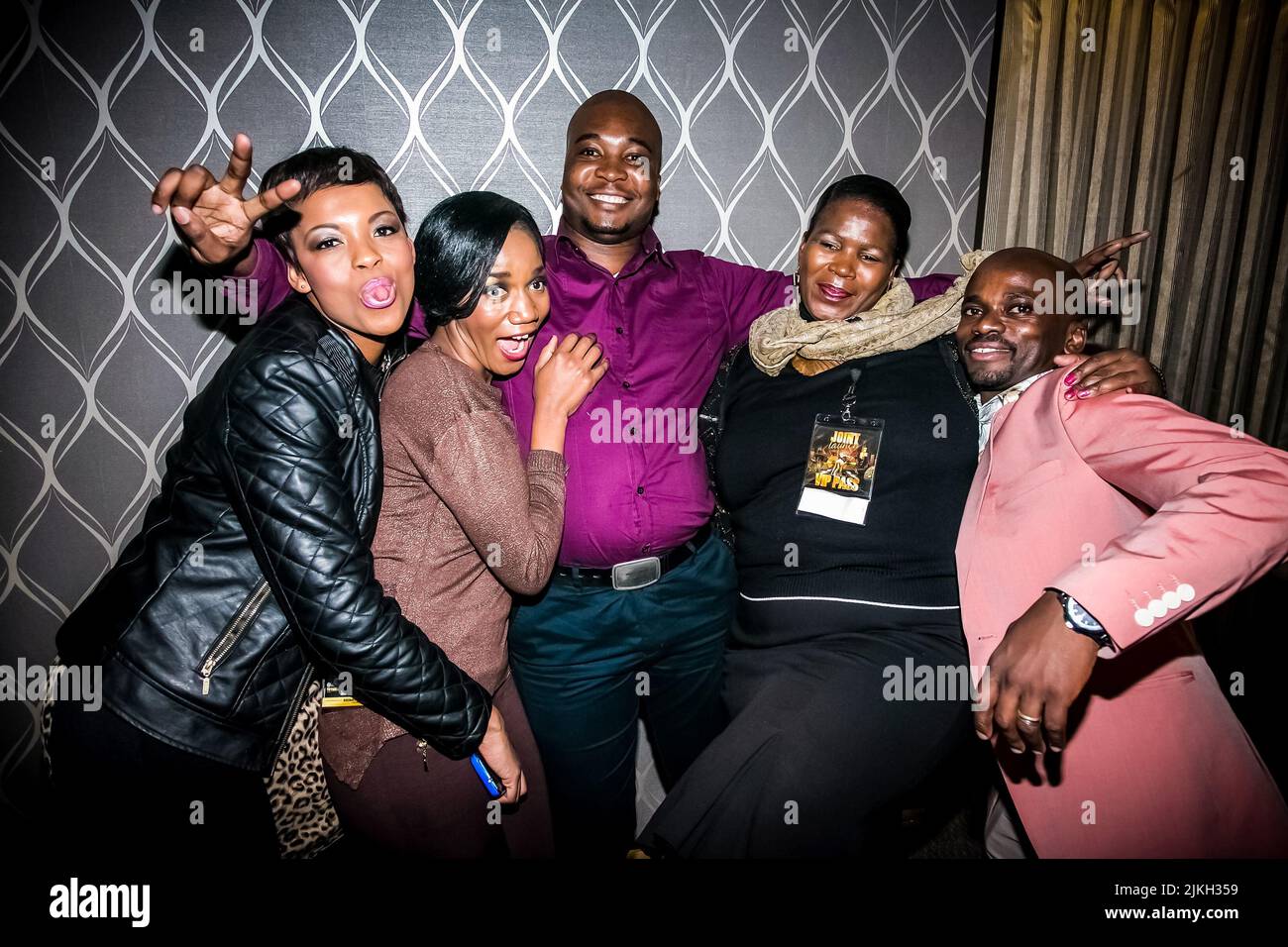 A group of African American people posing at a fancy cocktail event ...