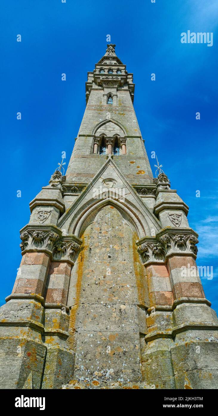A low angle shot of Sir Tatton Sykes Monument against a blue sky in ...