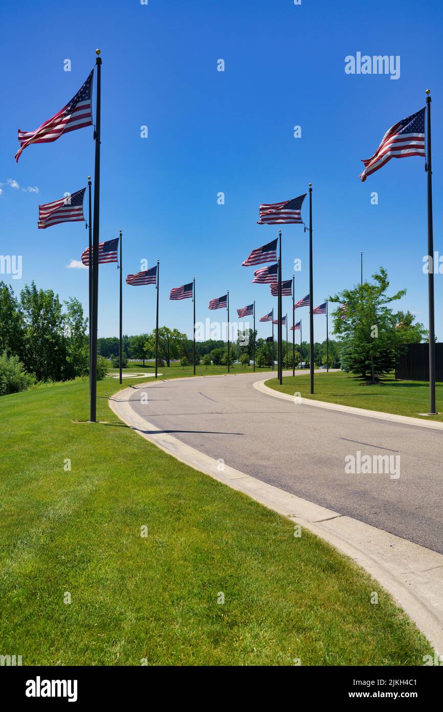 A vertical shot of memorial park surrounded by American flags on flag ...