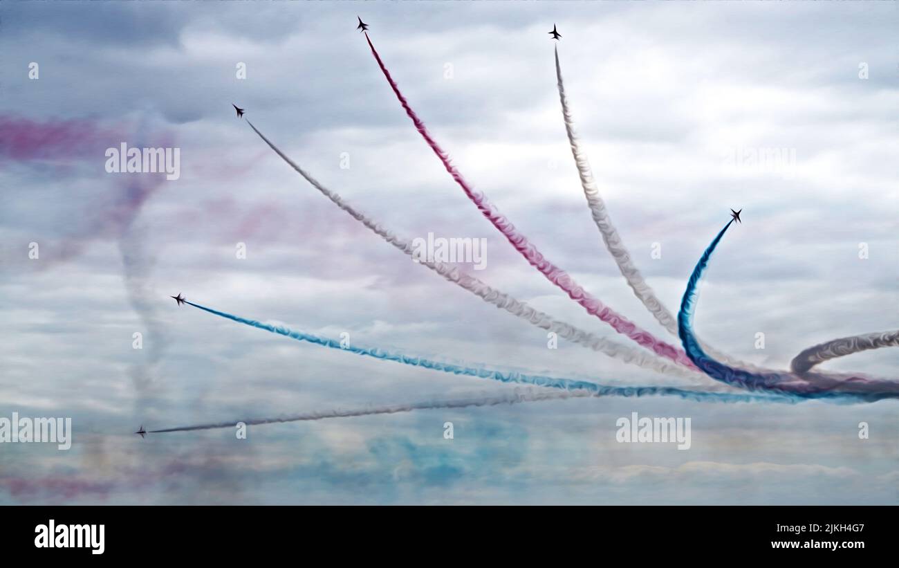 An aerial shot of a colorful airplane smoke show Stock Photo - Alamy