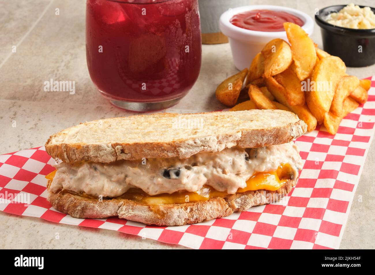 A homemade tuna sandwich with fries and sauce Stock Photo - Alamy