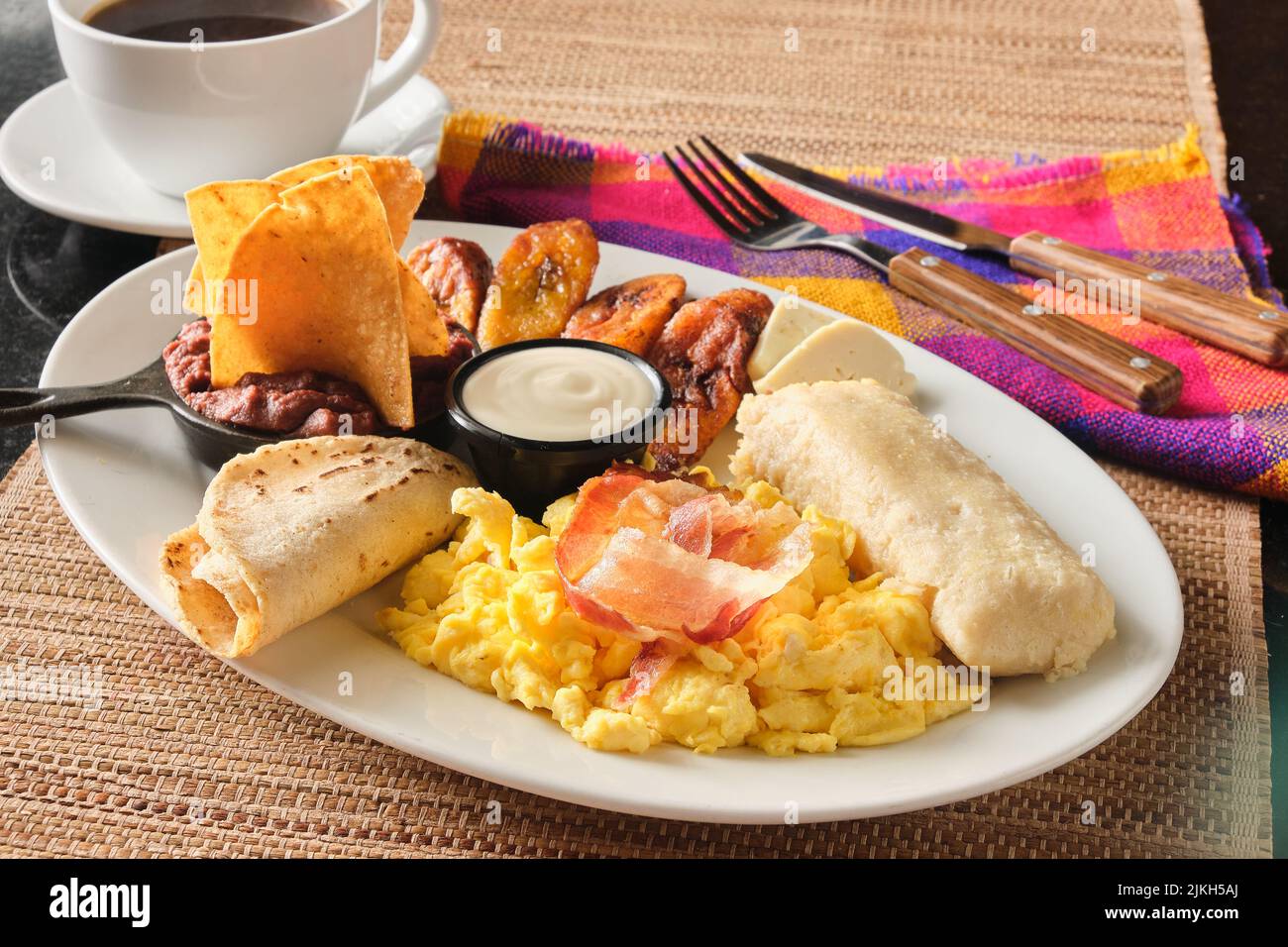 A closeup shot of a typical breakfast with fried plantains, tortilla ...
