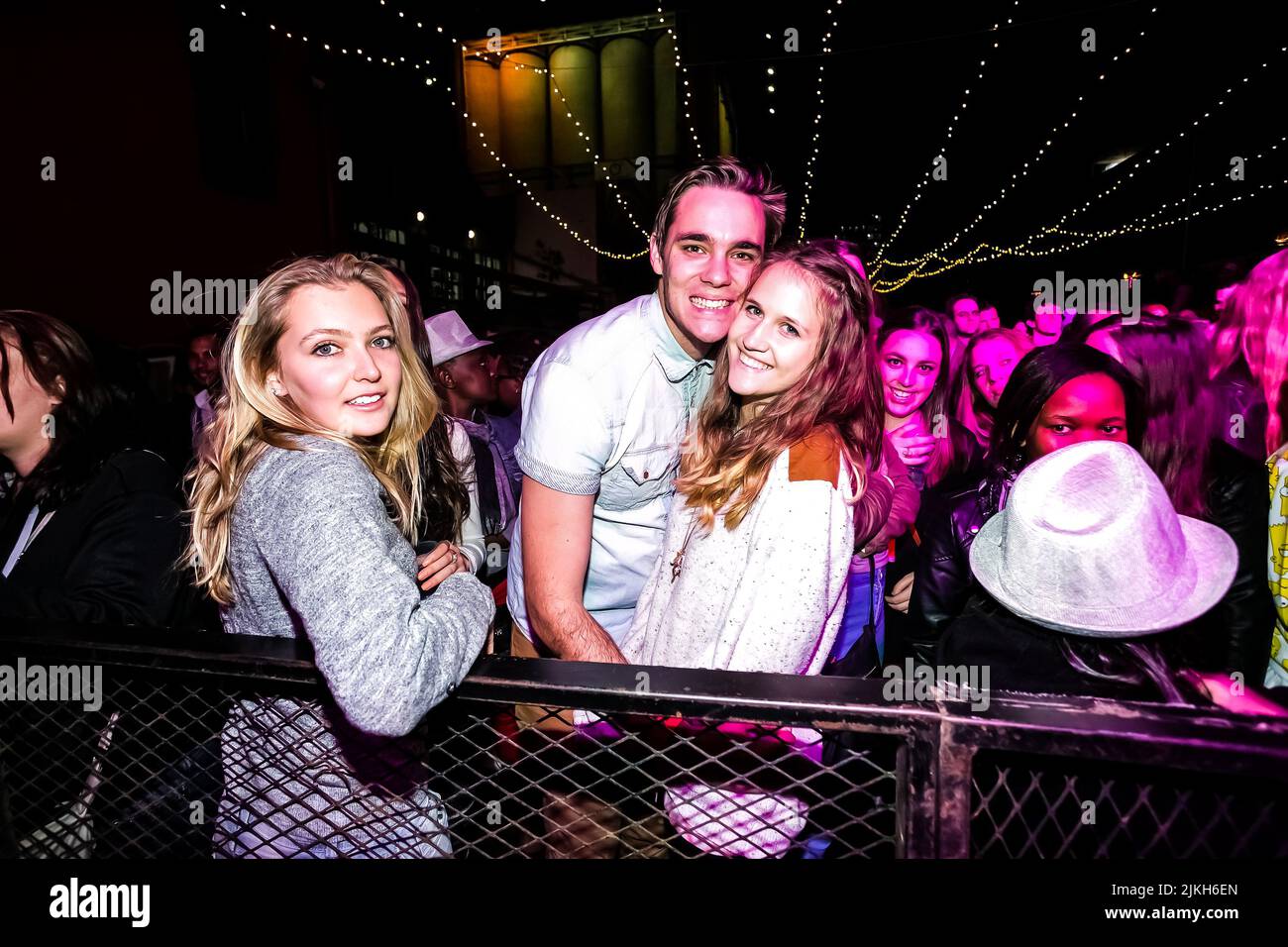 Trendy young people attending a music concert Stock Photo - Alamy