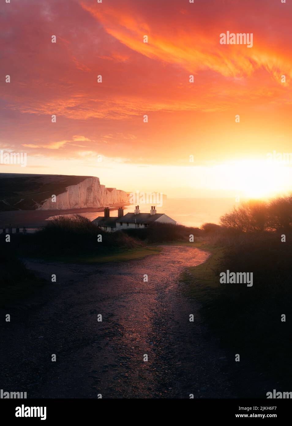 A vertical shot of Seven Sisters cliffs at the beautiful sunset ...