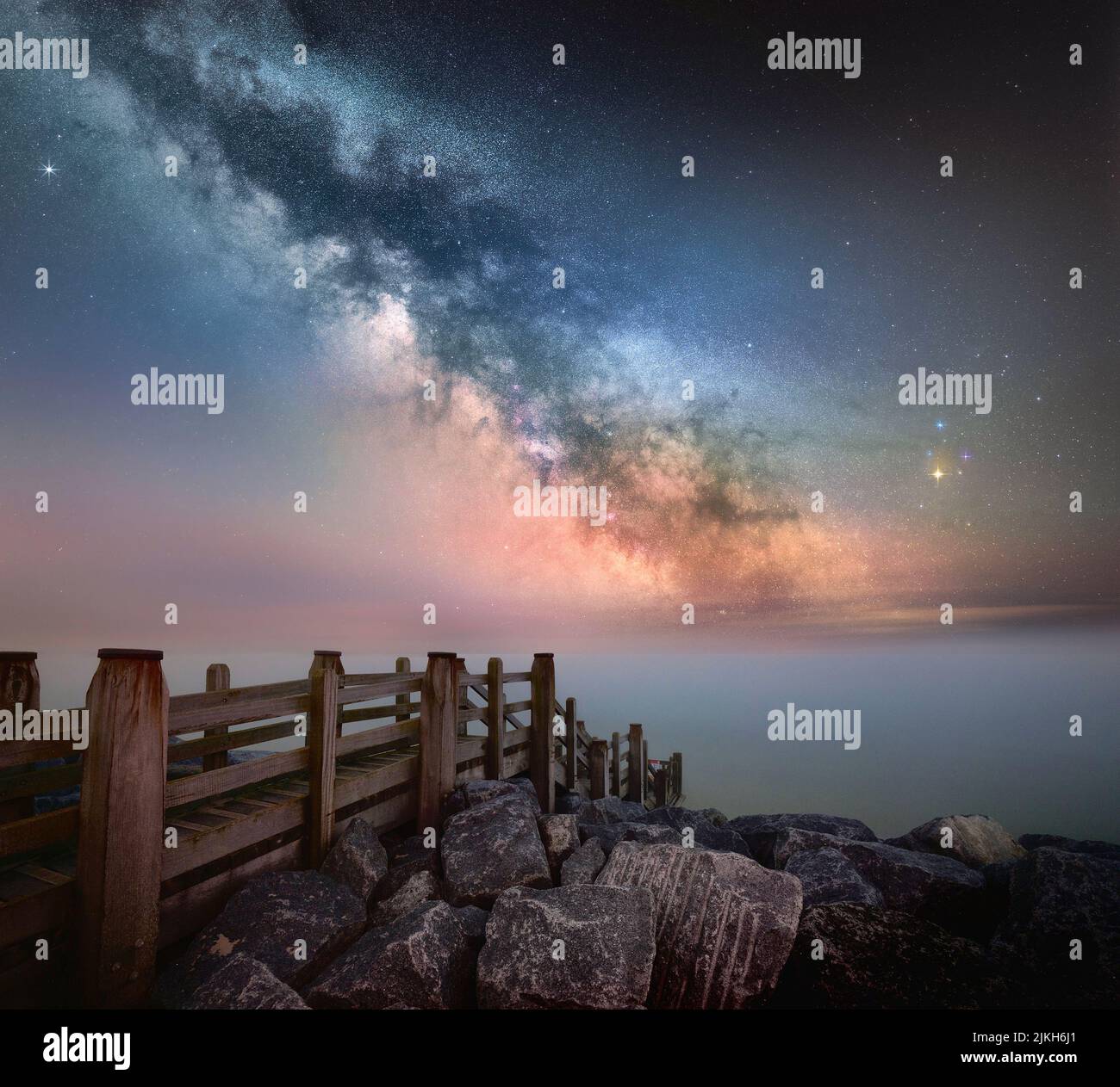 The view of the boardwalk and rocks against the Milky Way. Beautiful ...