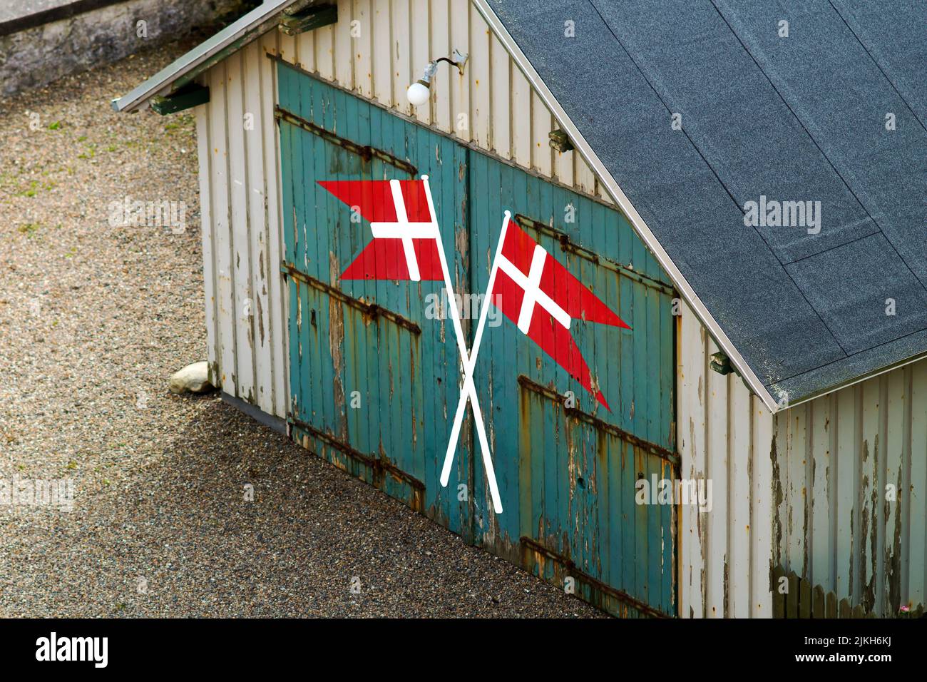 An aerial view of two Danish flags on an old garage door Stock Photo ...