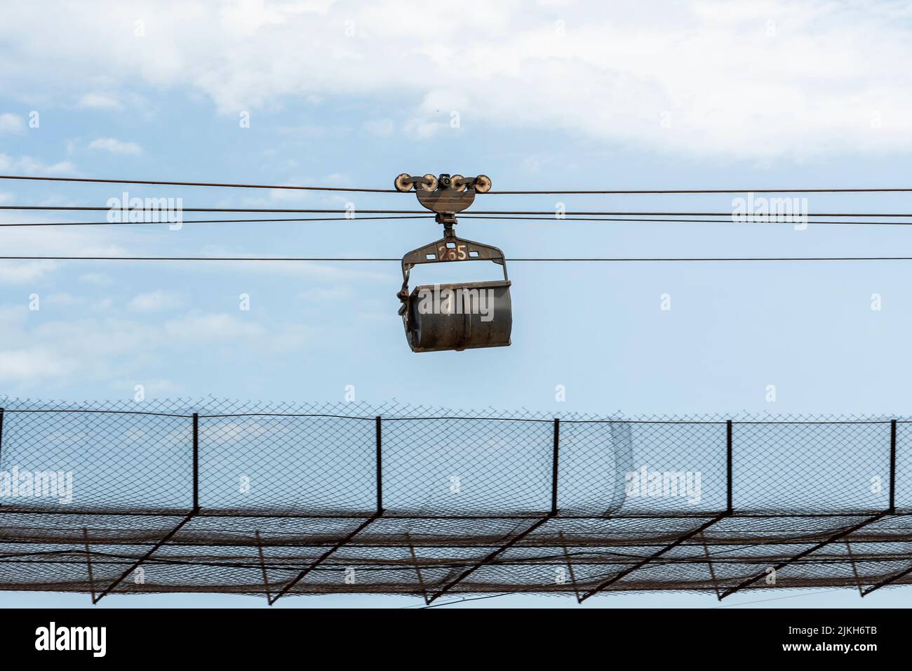 Protected industrial ropeway, on which trolleys move, empty and loaded ...