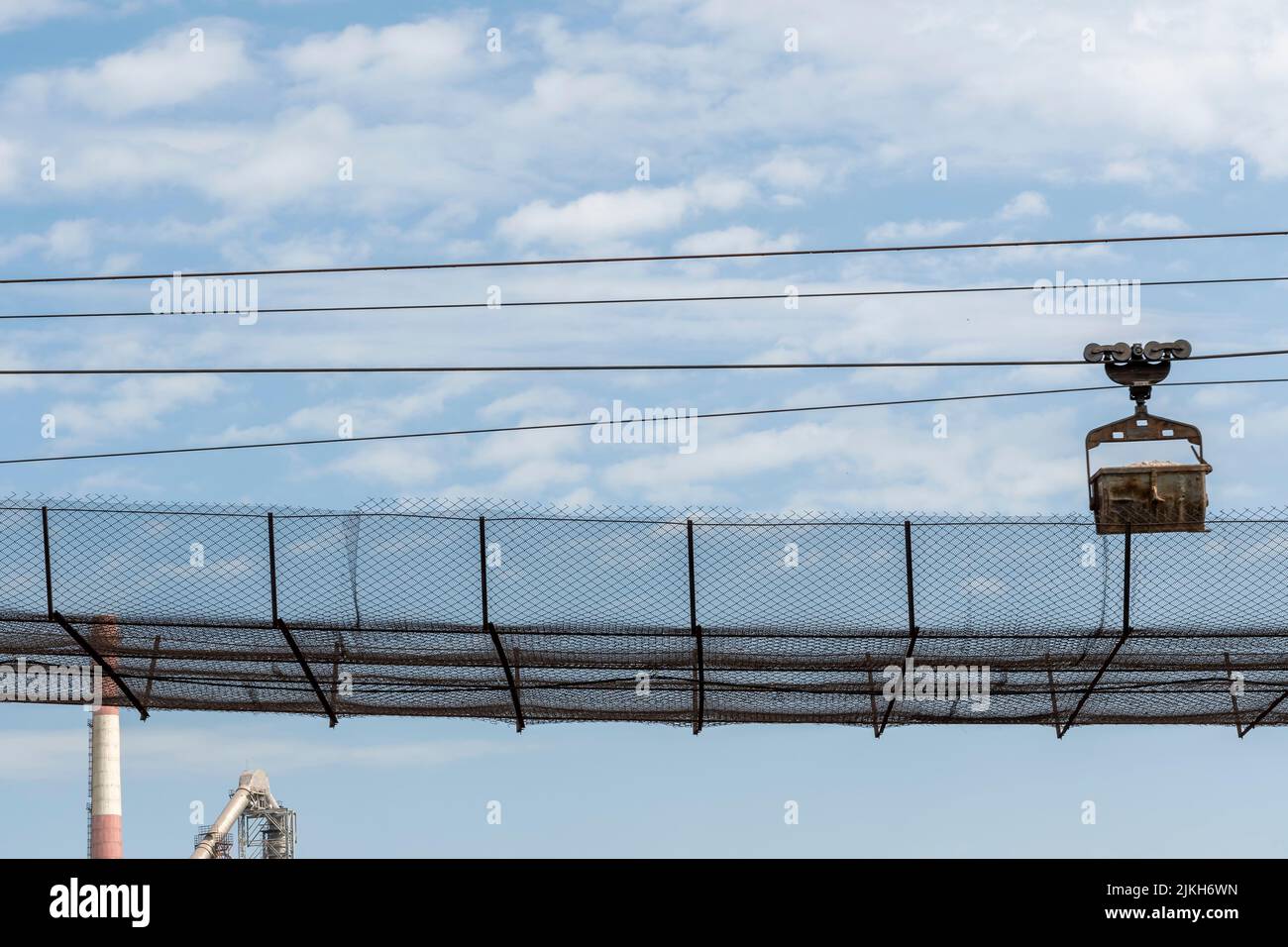 Protected industrial ropeway, on which trolleys move, empty and loaded ...