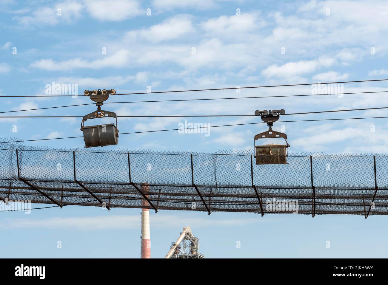 Protected industrial ropeway, on which trolleys move, empty and loaded ...