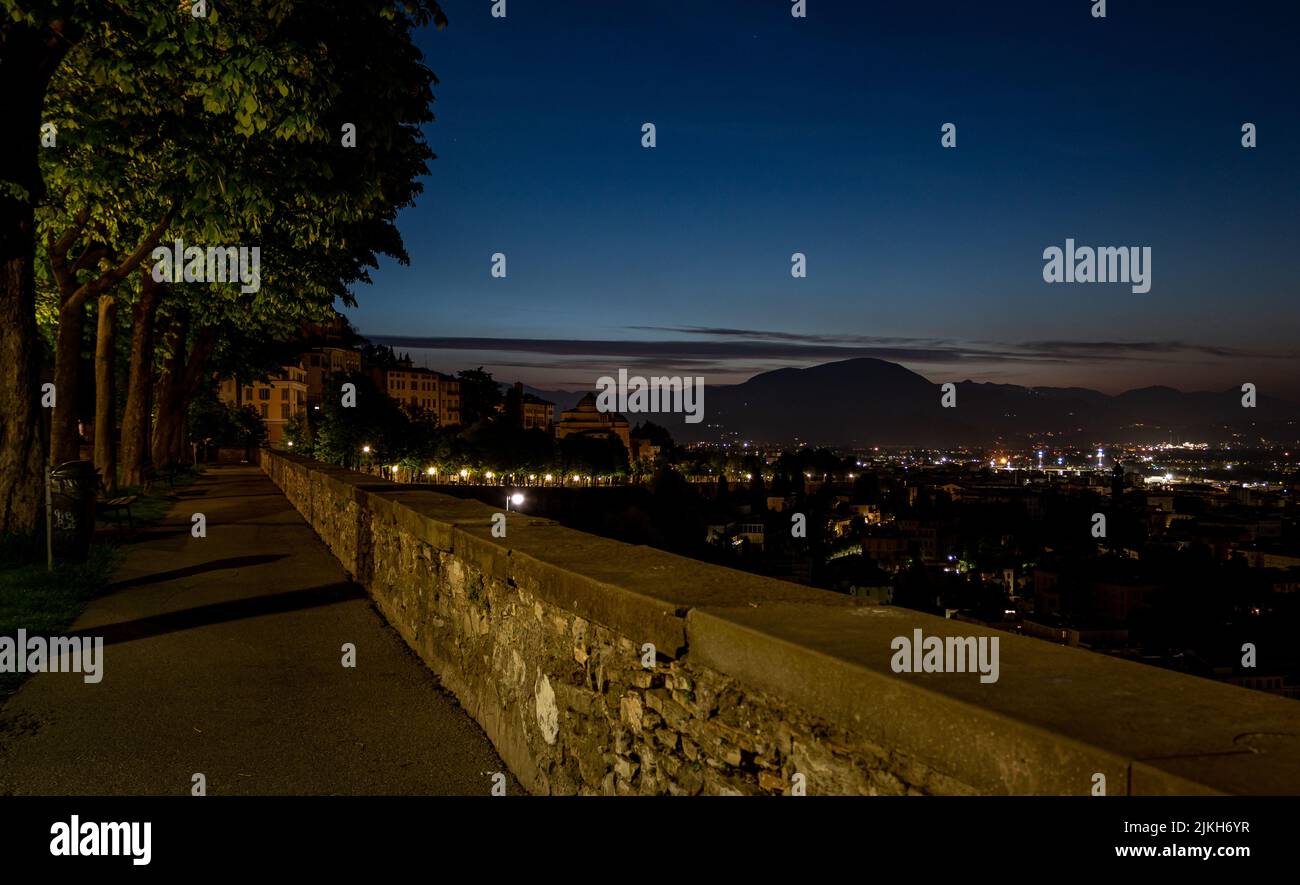 An aerial view of modern buildings at night in Bergamo, Italy Stock ...