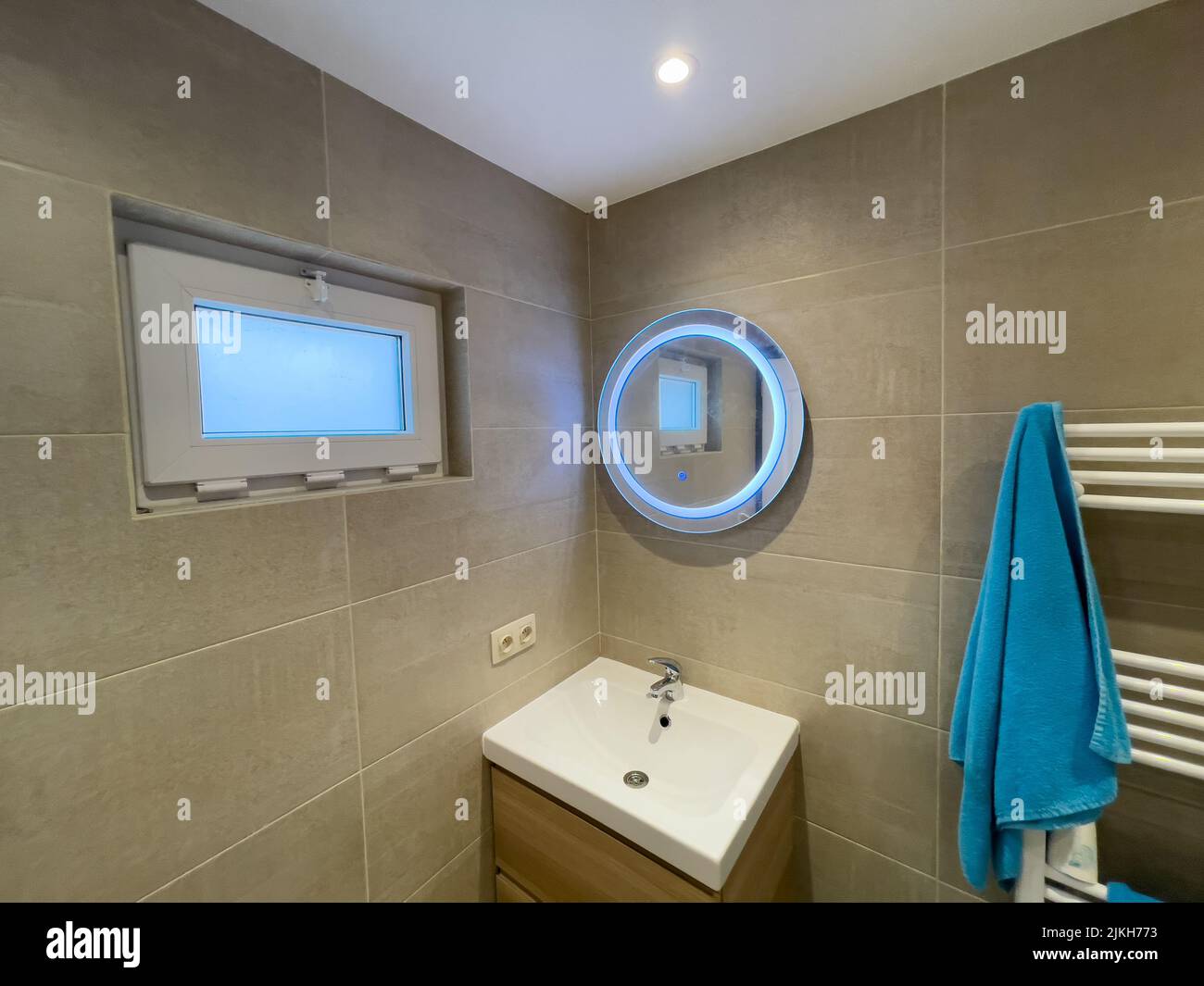 Modern interior of a toilet with lights on Stock Photo - Alamy