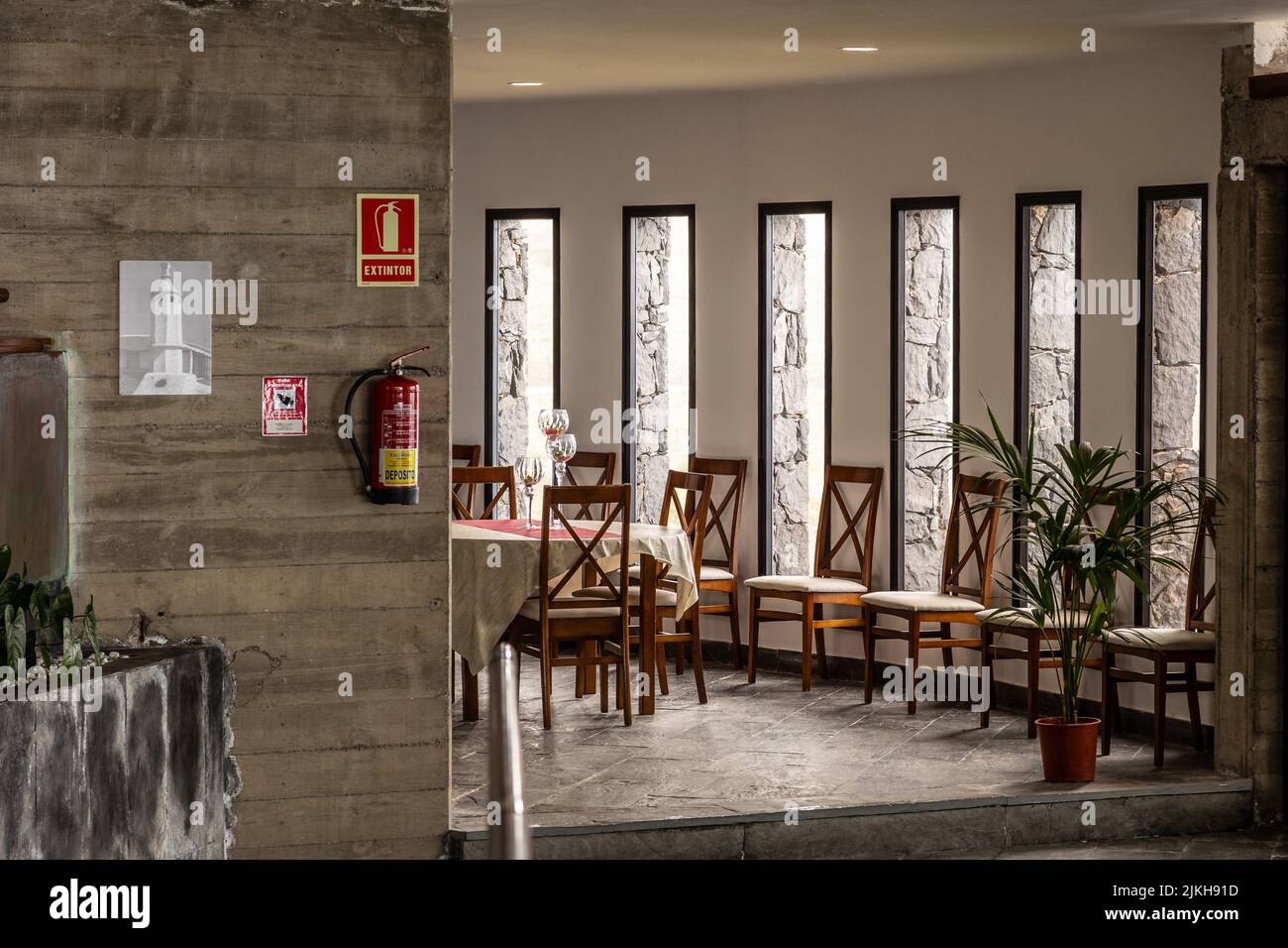 The interior of a luxury restaurant with rows od wooden chairs and ...