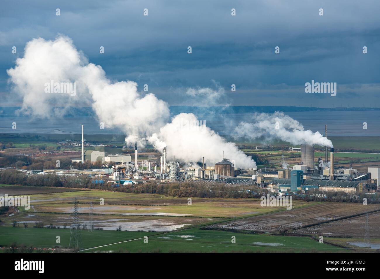 A daylight shot of a factory with smoke, the concept of pollution Stock ...