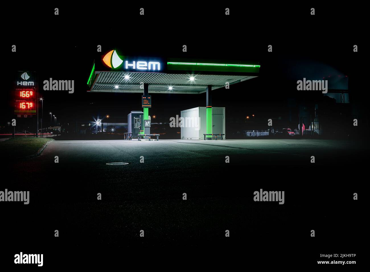 An illuminated Hem gas Station at night Stock Photo - Alamy