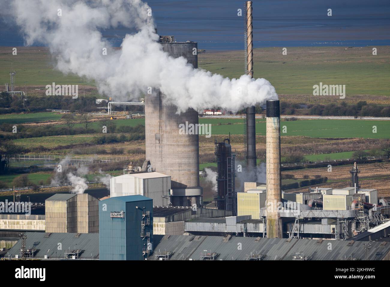 A daylight shot of a factory with smoke, the concept of pollution Stock ...