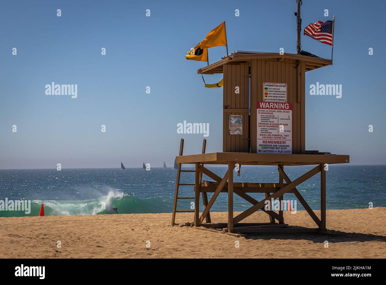 The Newport Beach Lifeguard shack with flags and information Stock ...