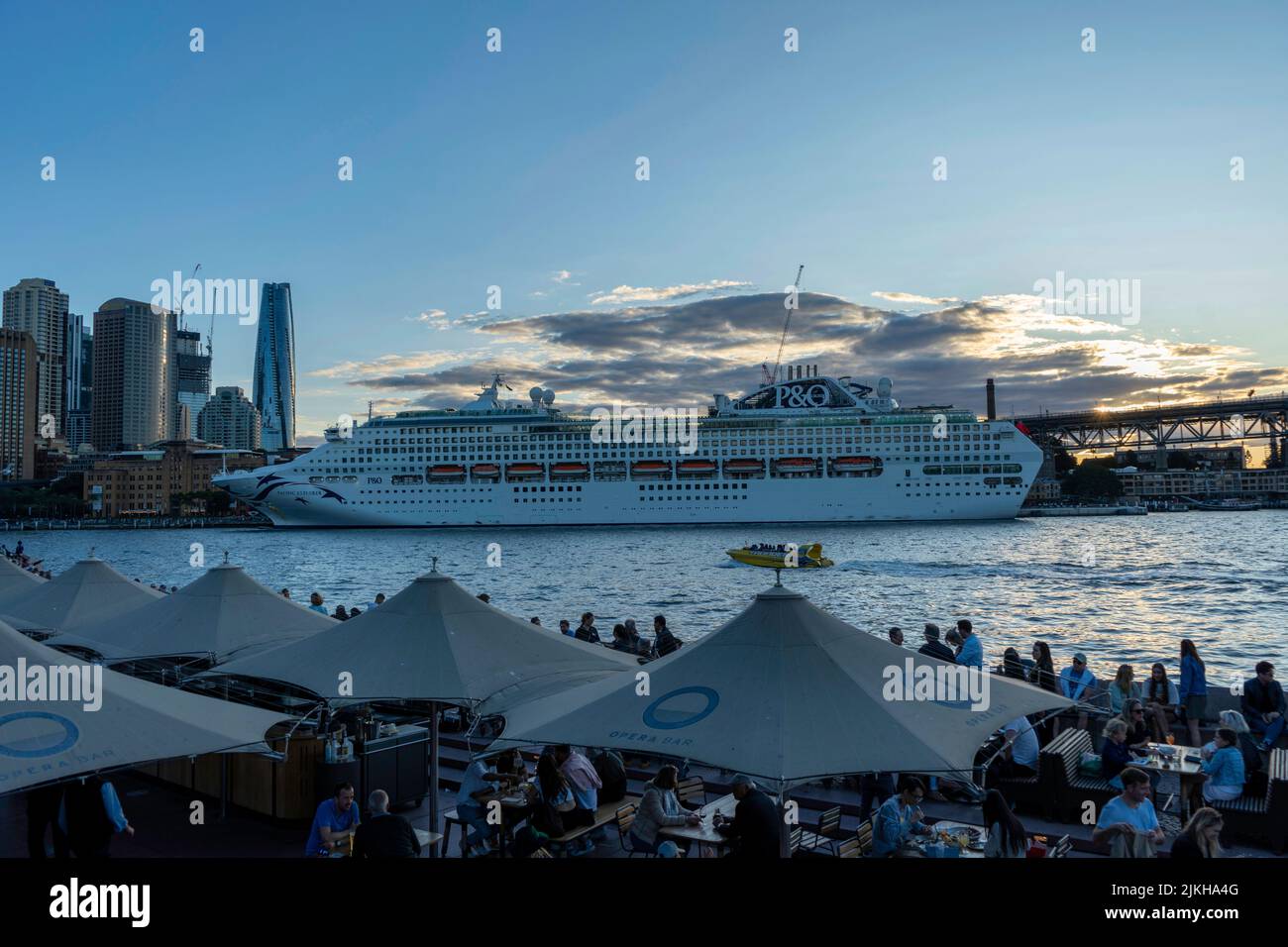 The view of the Pacific Explorer cruise ship in Sydney Harbor at sunset ...