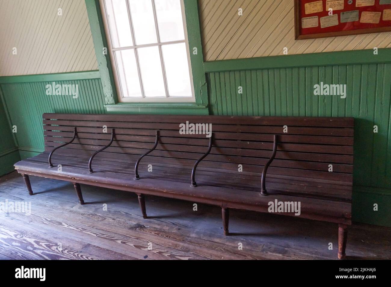 A long wooden brown bench with handles Stock Photo - Alamy