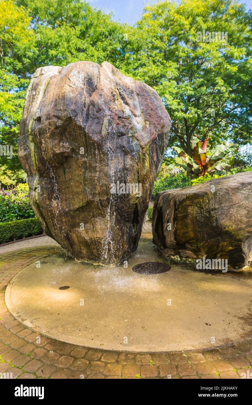 A vertical shot of a rock fountain in the Rosetta Mcclain Gardens in ...