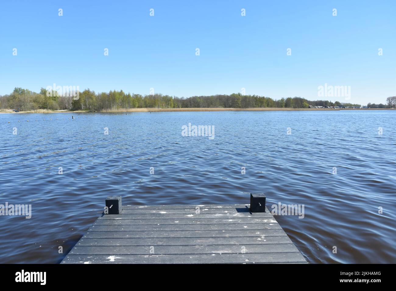 The edge of a jetty in the lake Stock Photo - Alamy