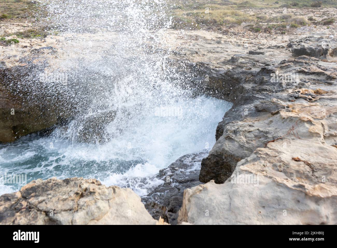 A closeup of water splashings on the rocks Stock Photo - Alamy