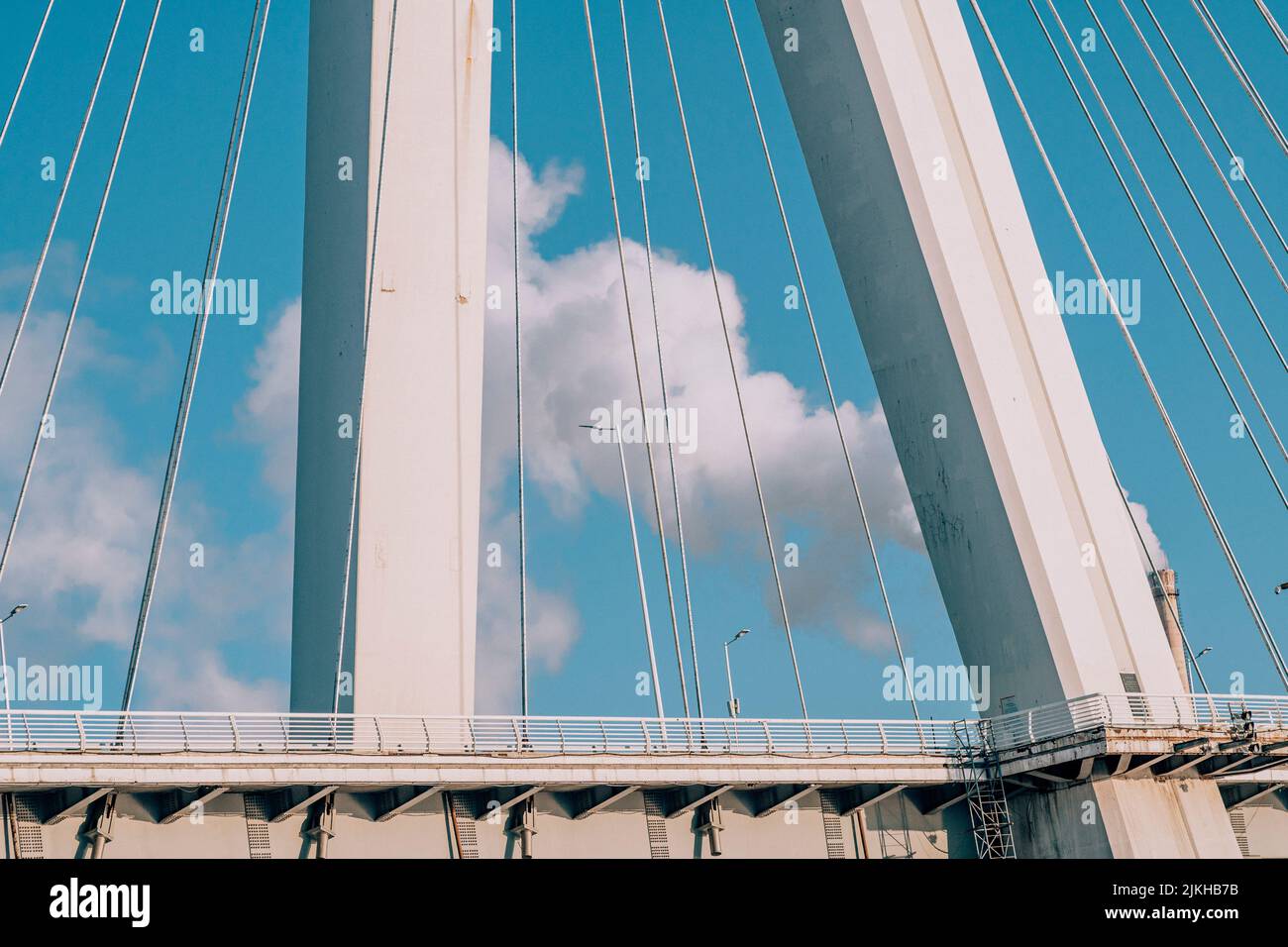 The details base of Alamillo Bridge in Seville, Spain with blue sky and ...