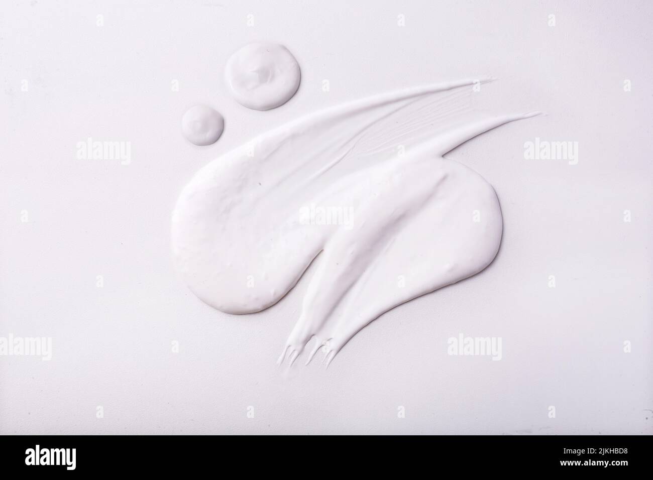 A white paint on the painting paper Stock Photo - Alamy