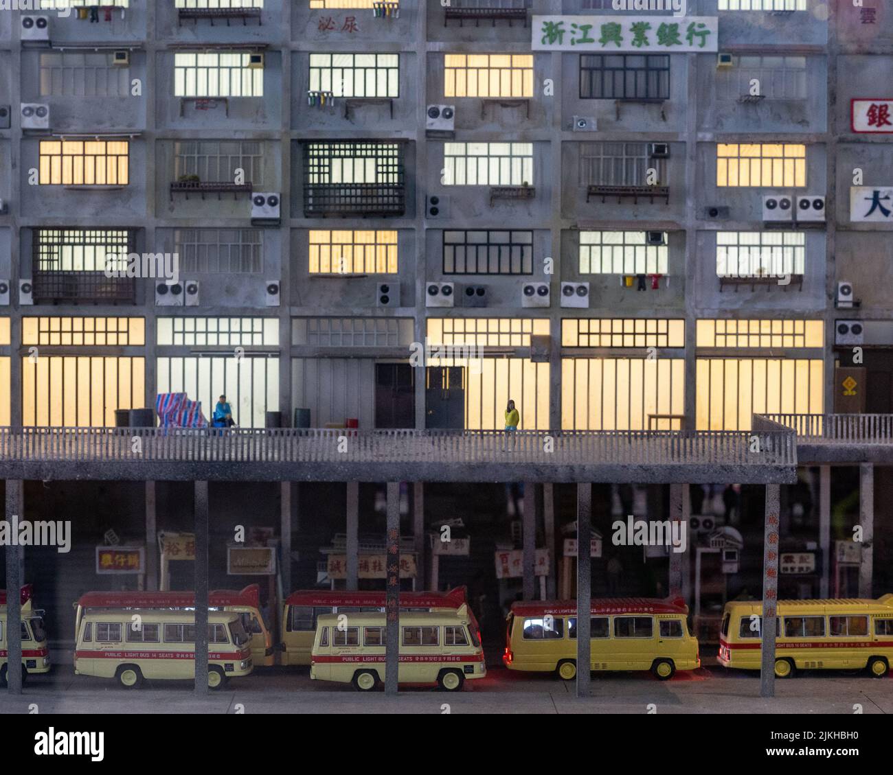 A mini exhibit of old building with illuminated windows over a station ...