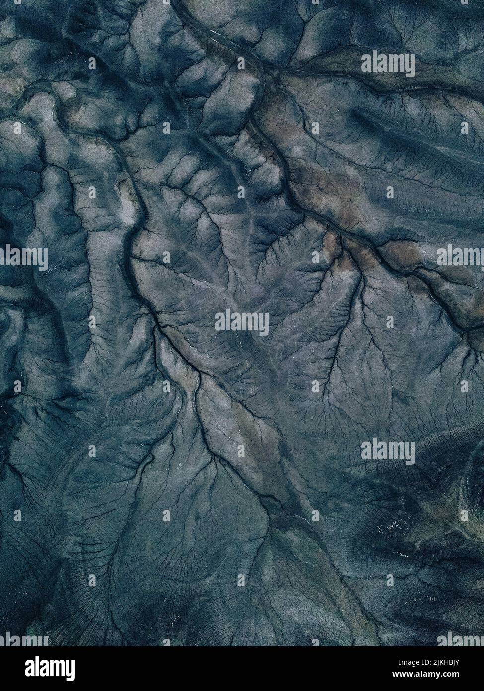 A vertical gray rocky background with a natural cracked pattern Stock ...