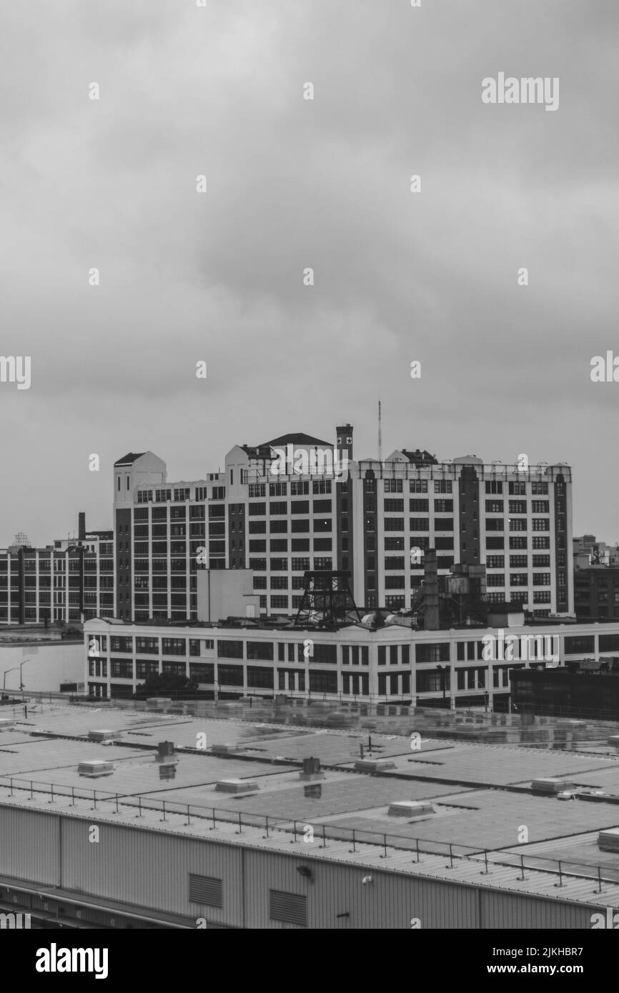 A vertical greyscale picture of buildings Stock Photo - Alamy