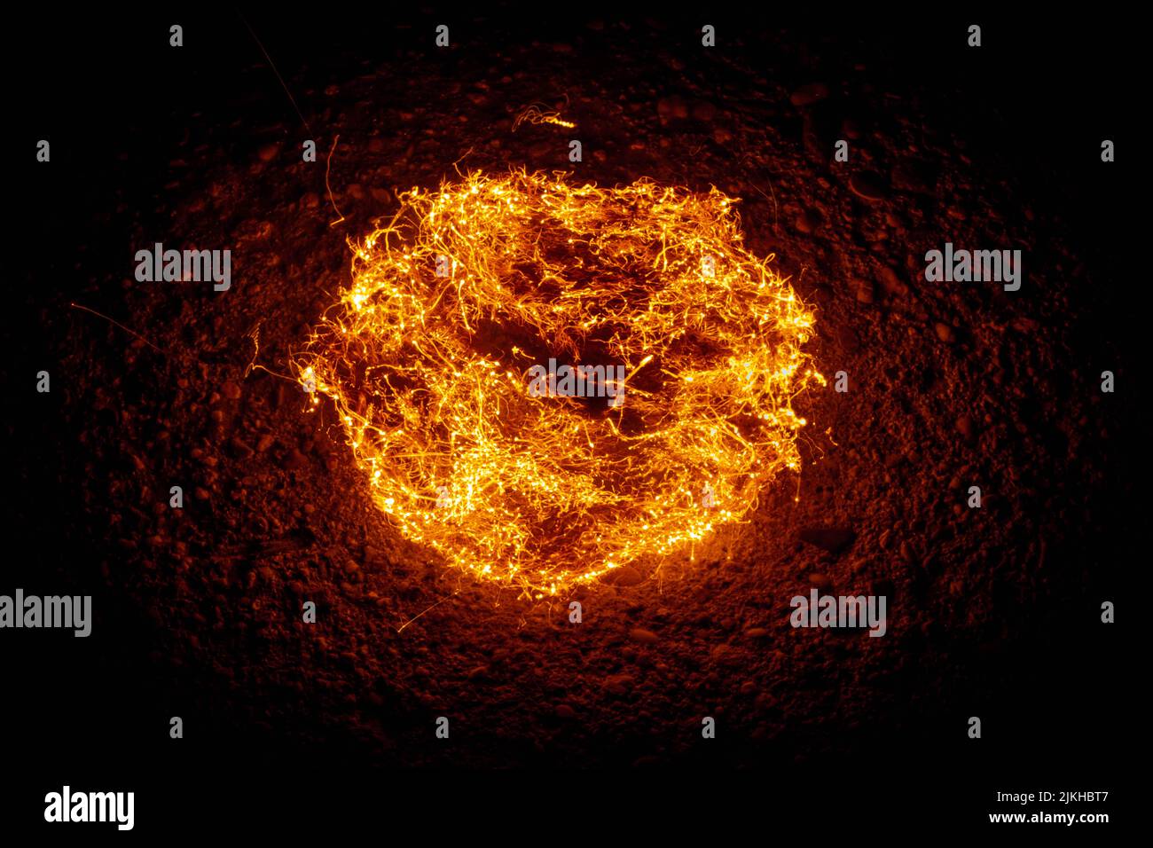 A Closeup of a burning hot fire on an asphalt Stock Photo - Alamy