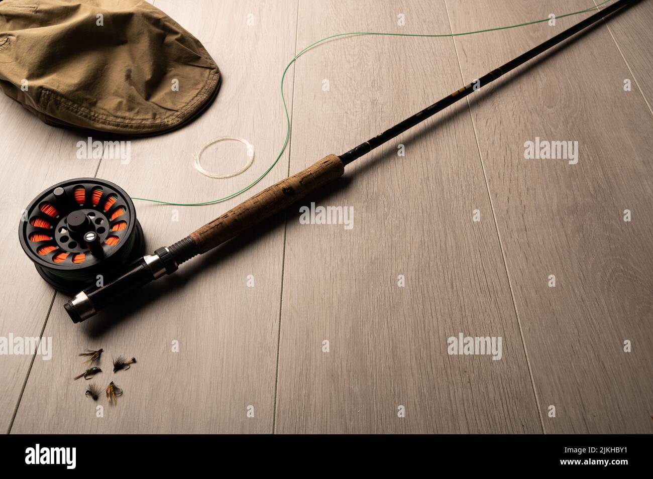 Fly fishing tackle on a light wood background with copy space Stock ...