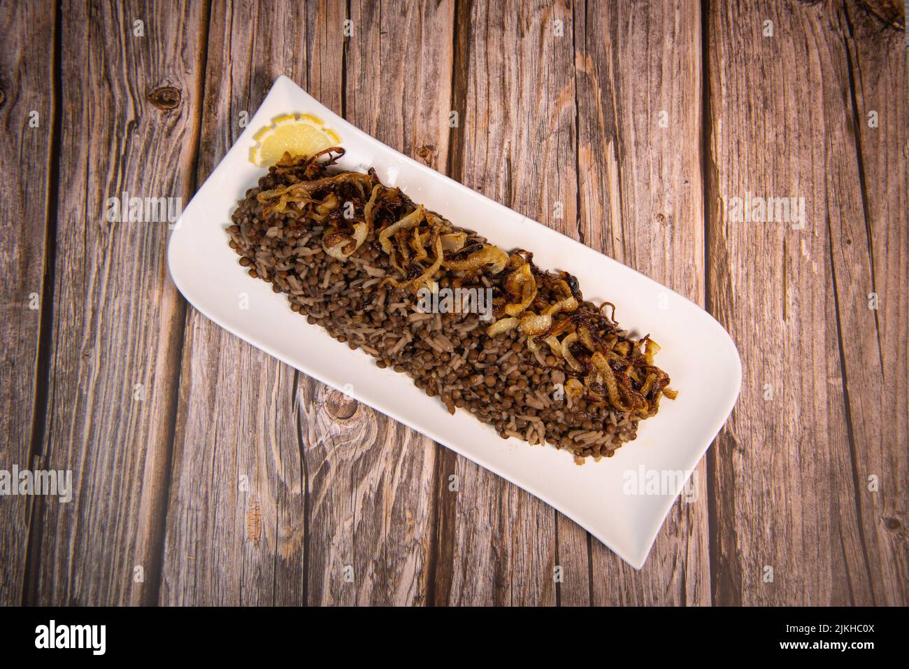 VEGAN LEBANESE LENTILS WITH GOLDEN ONIONS AND RICE RECIPE , MDARDARA B'RIZ Stock Photo - Alamy