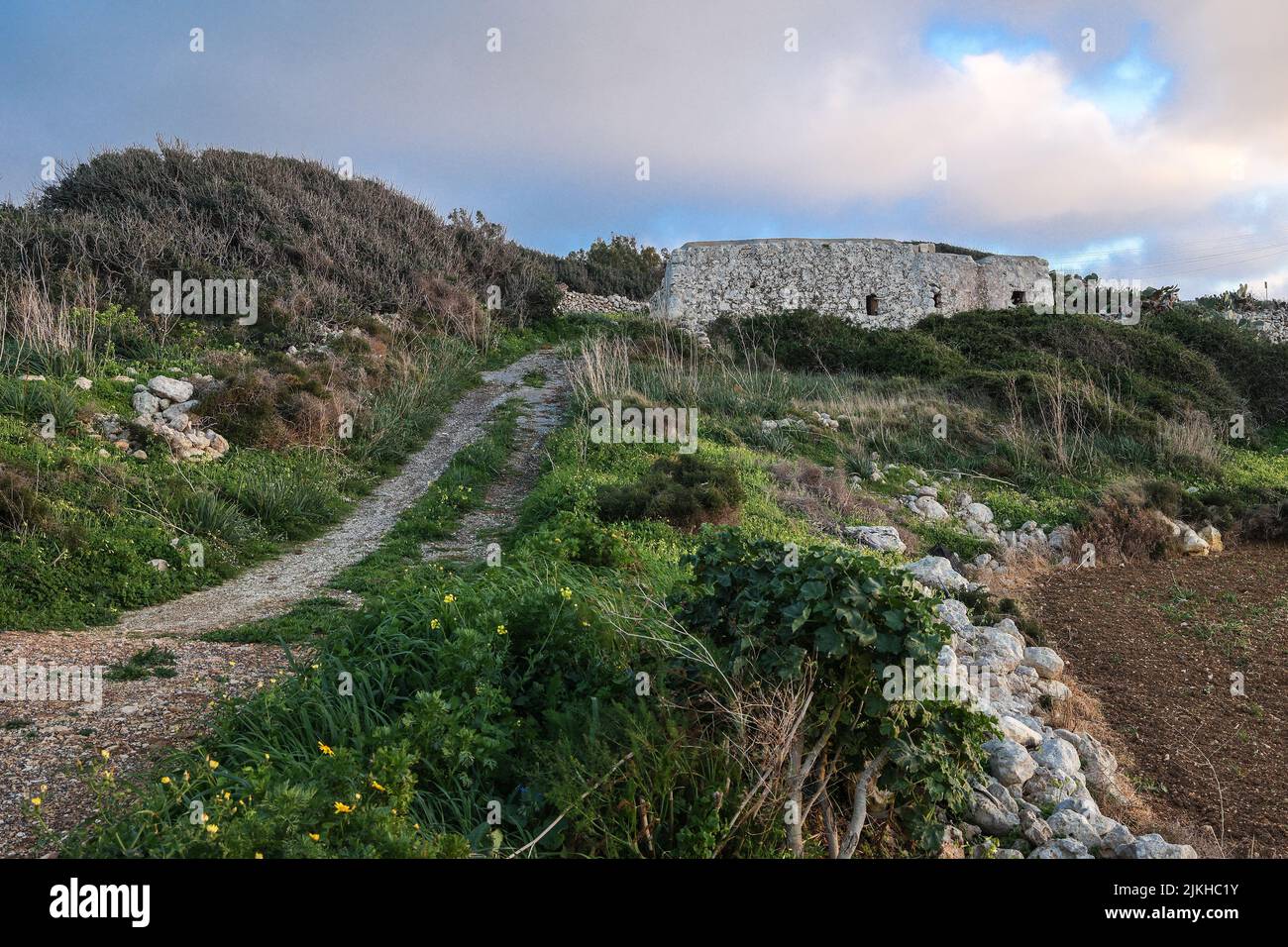 Ancient farmhouse, built of grey limestone blocks and single storied ...