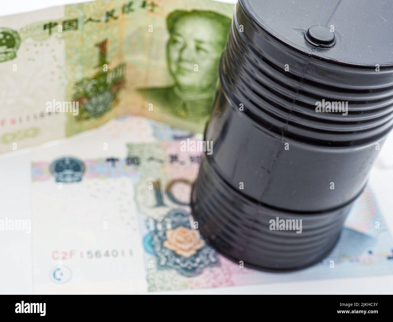 A barrel of crude oil on the background of Asian cash Stock Photo - Alamy