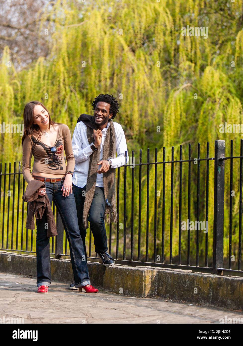 Park Life: spontaneous friends. A candid moment from a young mixed race ...