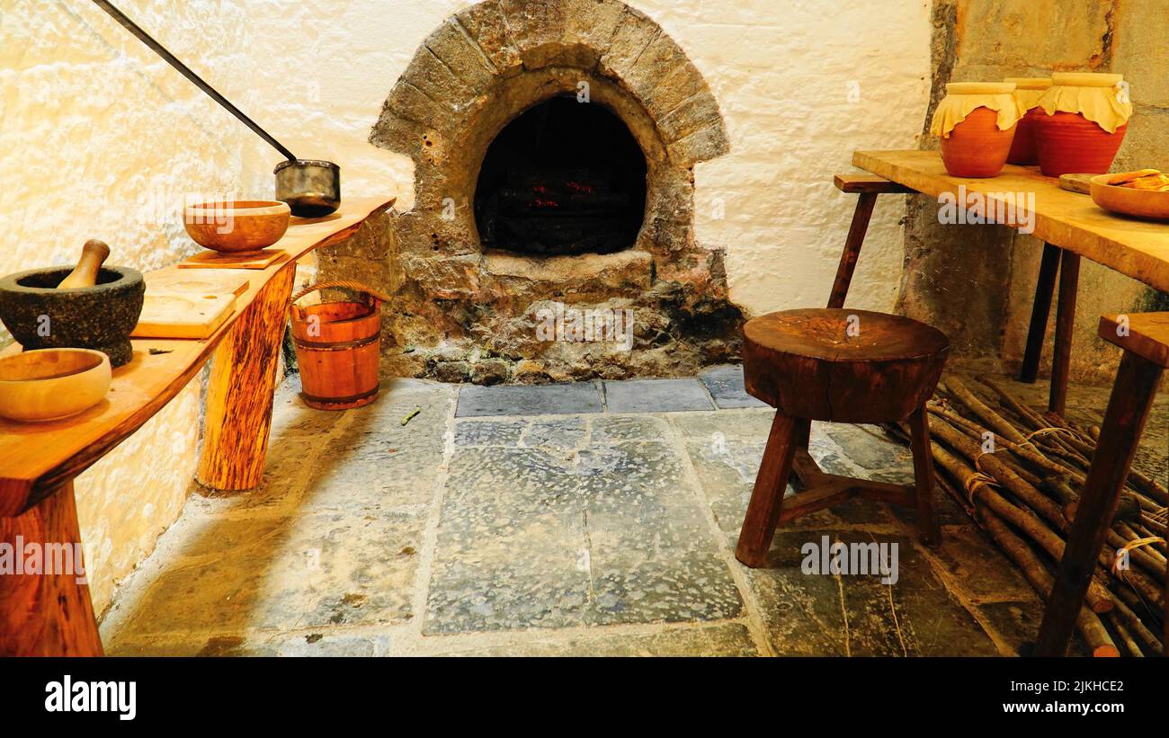 An old and traditional kitchen full of wooden kitchenware Stock Photo ...