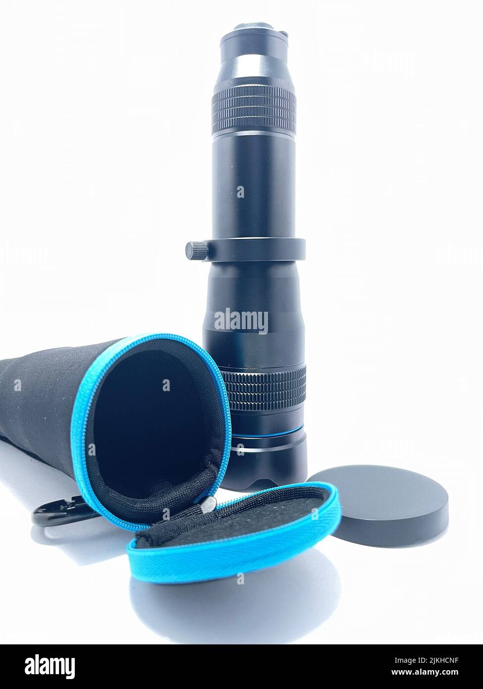 A mobile external metal telescope and its cover on a white background ...