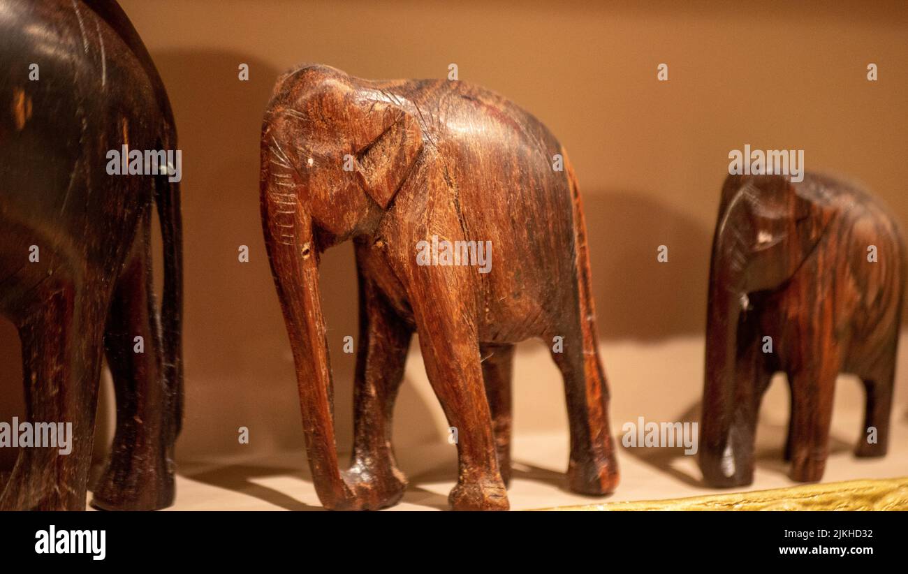 Wooden elephants as part of a home interior Stock Photo - Alamy