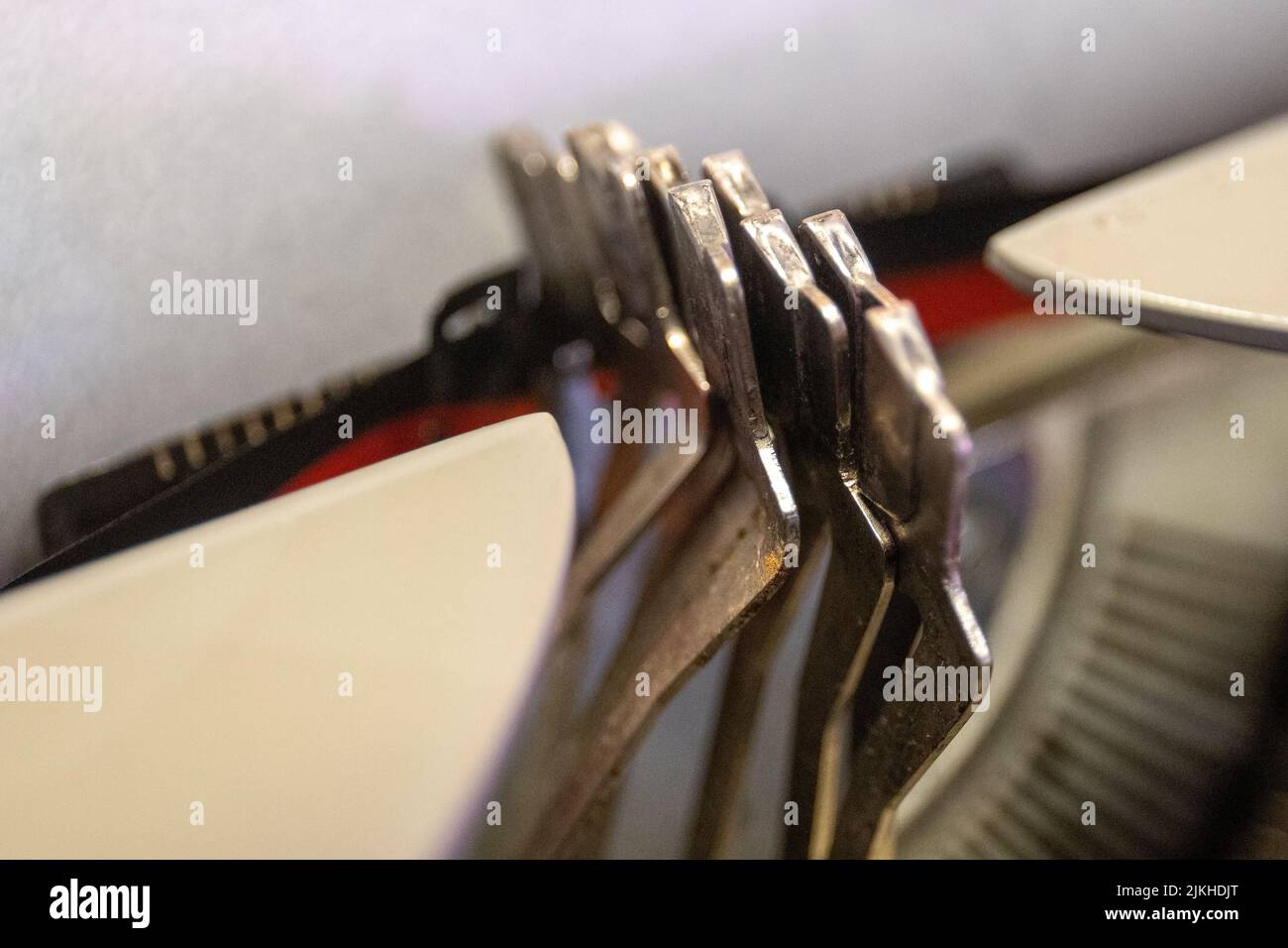 A closeup of an old school typewriter that is jammed Stock Photo - Alamy