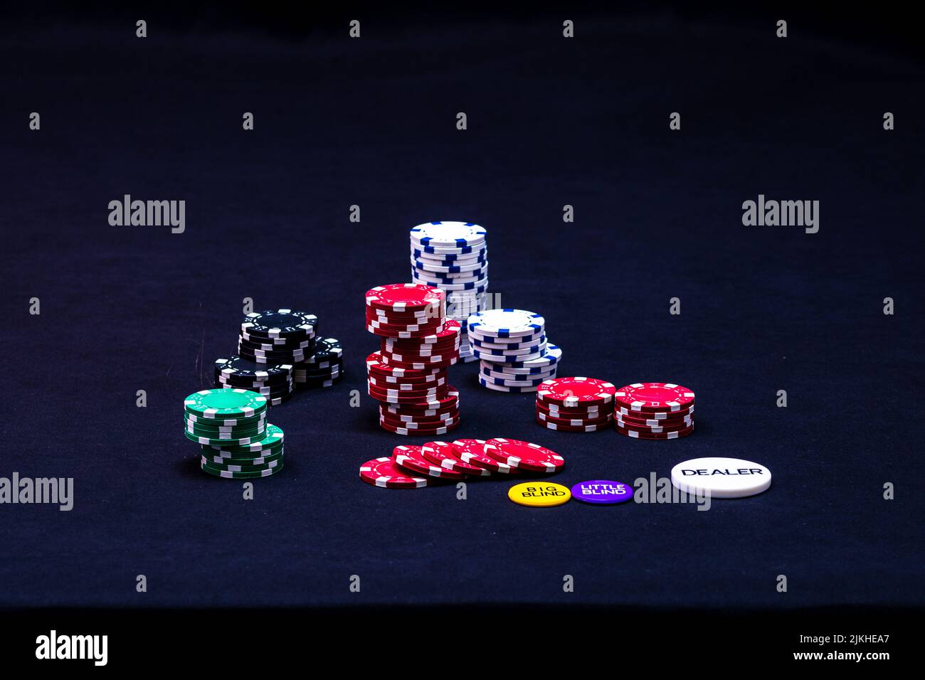 Stack of poker chips on black background Stock Photo - Alamy